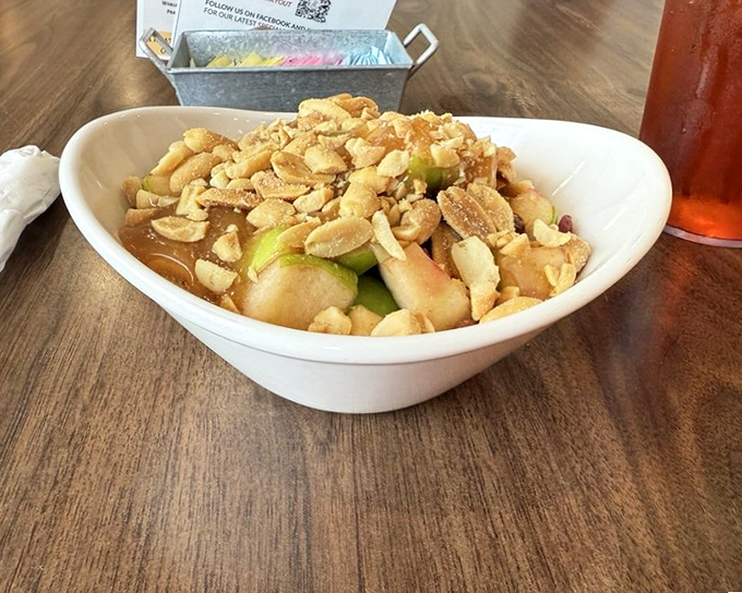 A fresh take on fruit salad – crisp apples and crunchy peanuts create a symphony of textures that somehow feels both indulgent and virtuous.