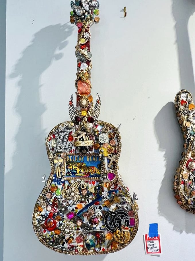 Not just a guitar—a wearable autobiography. Someone transformed this instrument into a bedazzled masterpiece celebrating Delray Beach in rhinestone glory.
