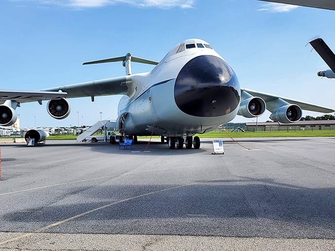 The C-5 Galaxy's nose cone opens like a whale's mouth, ready to swallow tanks, helicopters, or your neighbor's oversized holiday decorations.