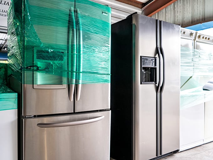 Stainless steel dreams wrapped in green plastic—where appliance hunters find kitchen upgrades without the markup of those fancy big-box stores.