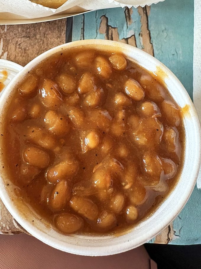 Baked beans swimming in a sweet and tangy sauce. Each spoonful delivers a perfect balance of textures and flavors.