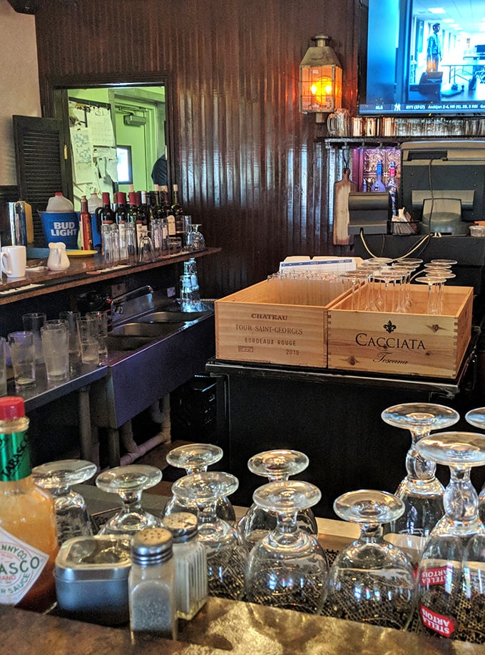 Behind every great tavern is a great bar—this one's stocked with everything needed to wash down that burger, including wine boxes repurposed as clever storage.