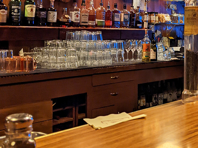 The bar isn't just stocked—it's a liquid library of California wine country, where stories flow as freely as the pours.