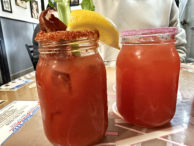Bloody Marys served in mason jars with proper garnishes—because sometimes breakfast needs a little kick to get the conversation flowing.