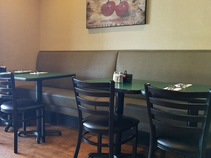 Cozy booths where breakfast dreams come true. That cherry artwork isn't just decoration—it's foreshadowing for your future pancake toppings.