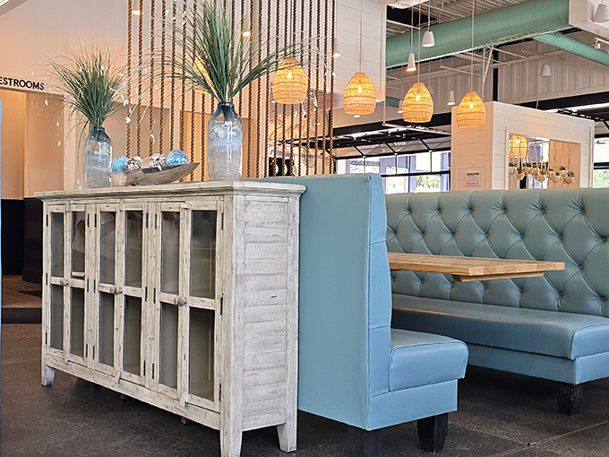 The tufted blue booths aren't just comfortable—they're practically begging you to settle in for another round of oysters and stories.