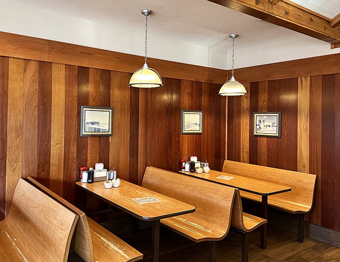 Wooden booths that have witnessed countless vacation plans, business deals, and the silent contemplation of "Should I order another donut?"