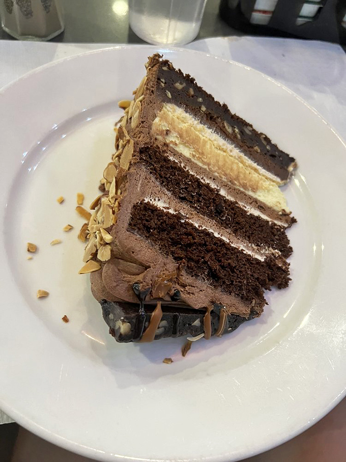 This isn't just chocolate cake—it's a towering monument to cocoa, with layers that deserve their own geological study.