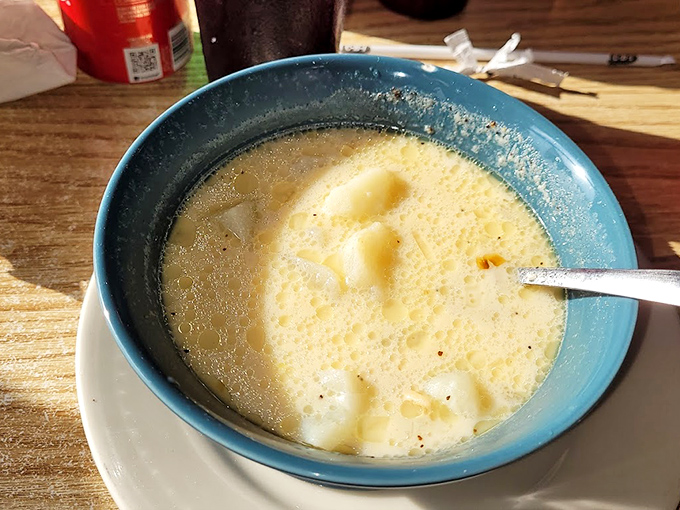 A bowl of clam chowder that looks like it could cure whatever ails you – creamy, chunky, and clearly made by someone who cares.