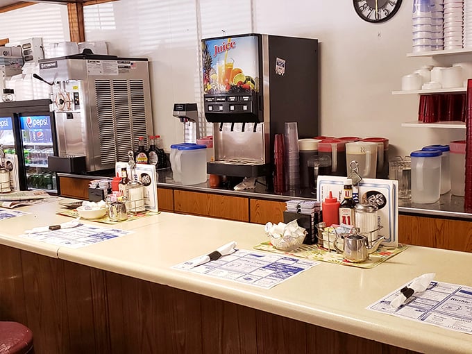 The beating heart of Ruthie's operation. This counter has witnessed more morning coffee rituals than most people have had hot showers.