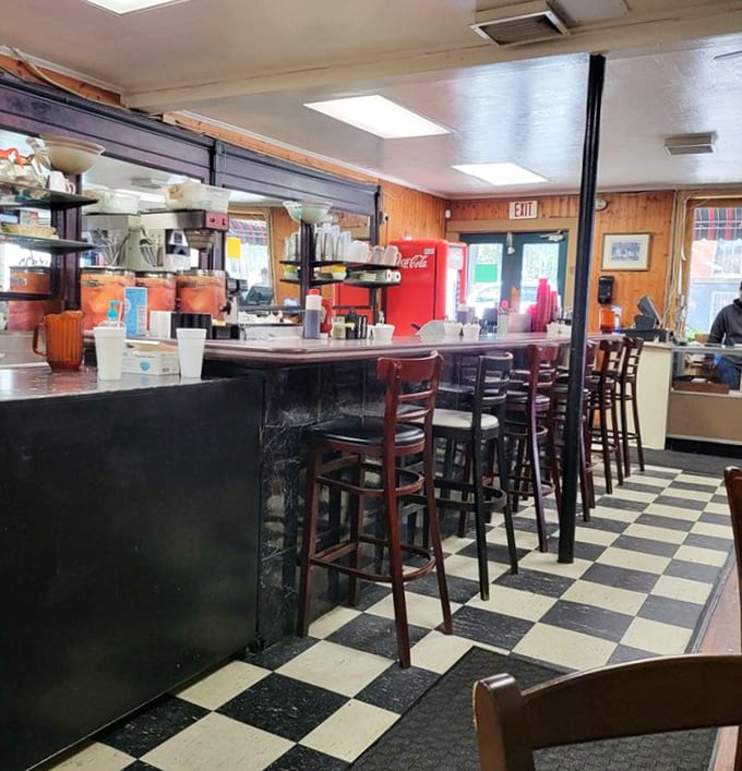 Counter seating offers front-row seats to the breakfast theater, where every order tells a delicious story.