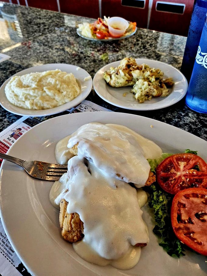 Country fried goodness smothered in gravy with sides that know their supporting role—this is comfort food that gives you an actual hug.