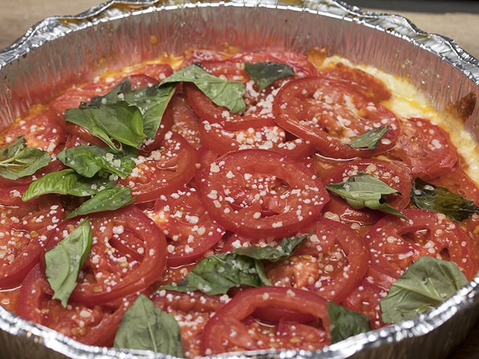 Two pizza styles, one kitchen's mastery – proof that excellence comes in many delicious forms and creative variations.