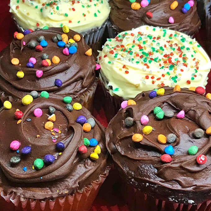 Cupcakes with sprinkles that spark joy like tiny edible confetti—proof that Woodchuck's understands dessert should be as fun as it is delicious.