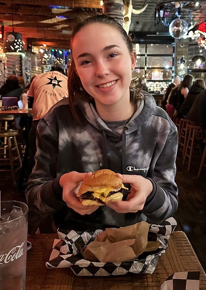 The universal expression of burger joy—that moment when you realize some food memories will stick with you long after the meal ends.