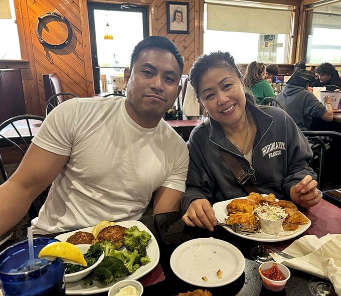 Happy diners experiencing what therapists call "seafood euphoria." That look when the food exceeds expectations and calories become just theoretical numbers.