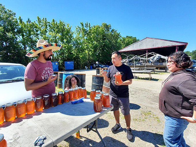 The outdoor honey vendor creates that perfect flea market moment—strangers connecting over something sweet and locally made.