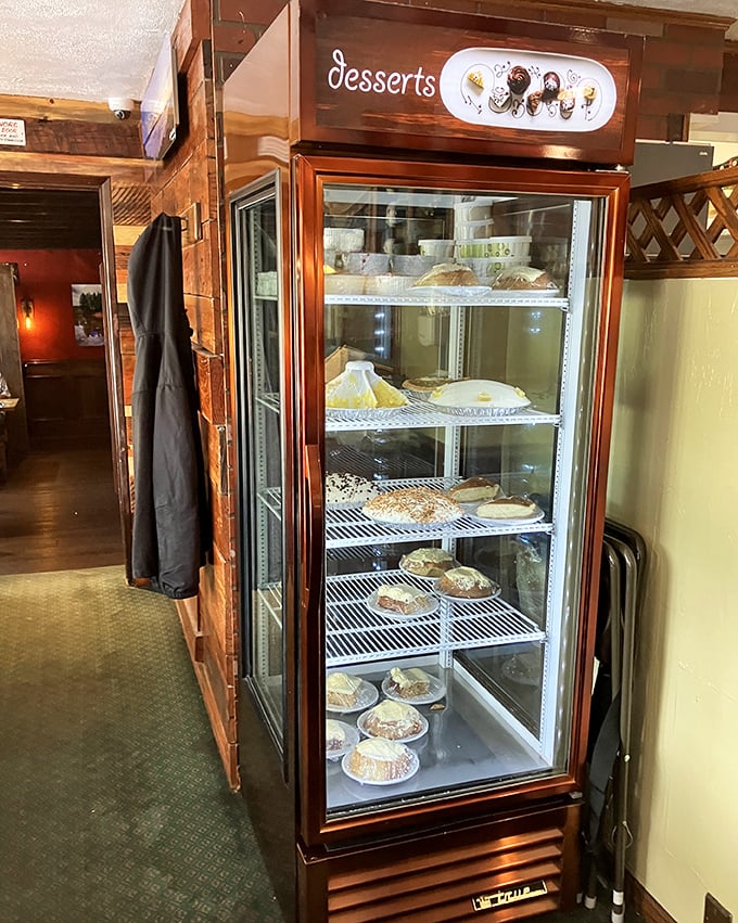 The dessert case—where willpower goes to die. Each pie represents a different way to justify having dessert before dinner.