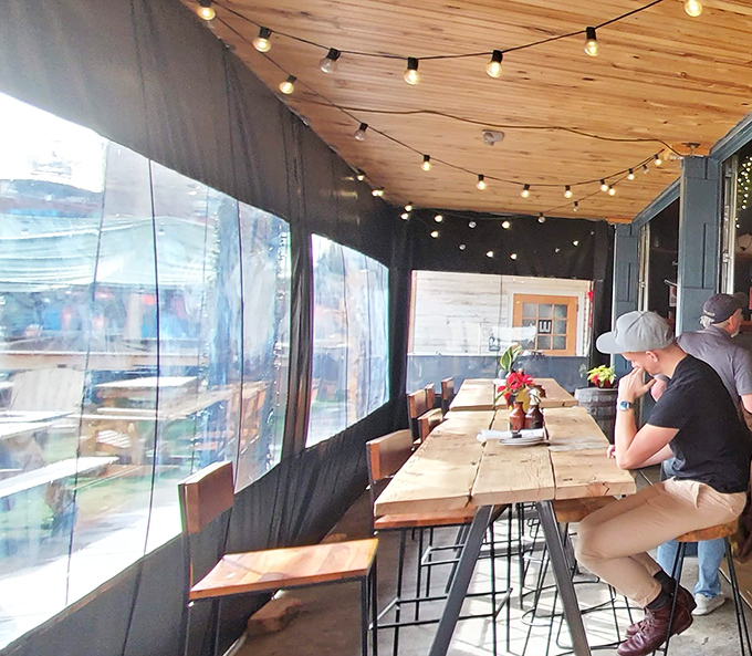 String lights, wooden ceilings, and tables built for sharing. The kind of covered patio where afternoon drinks turn into evening feasts.