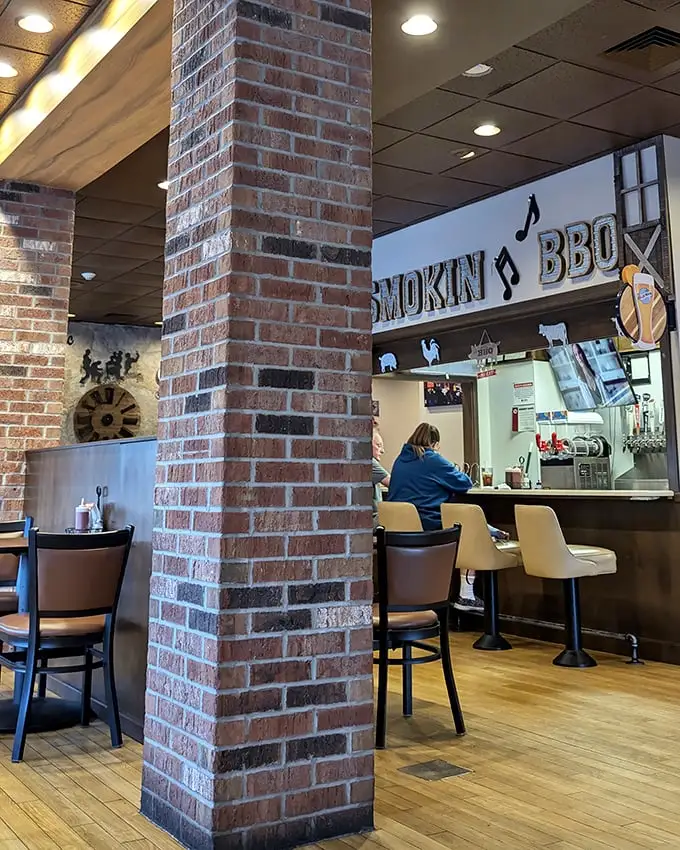 Exposed brick and comfortable seating create the perfect backdrop for the real star – barbecue worth driving across state lines to experience.