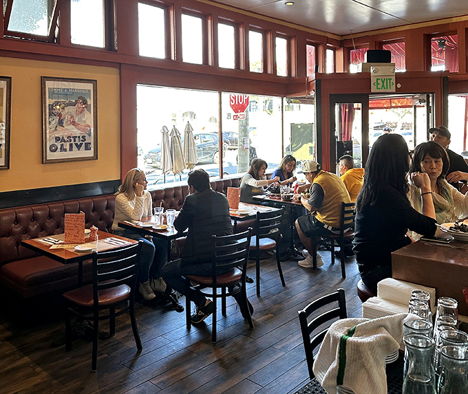 A dining room humming with the universal language of "mmm." Notice how nobody's looking at their phones—the food commands full attention.