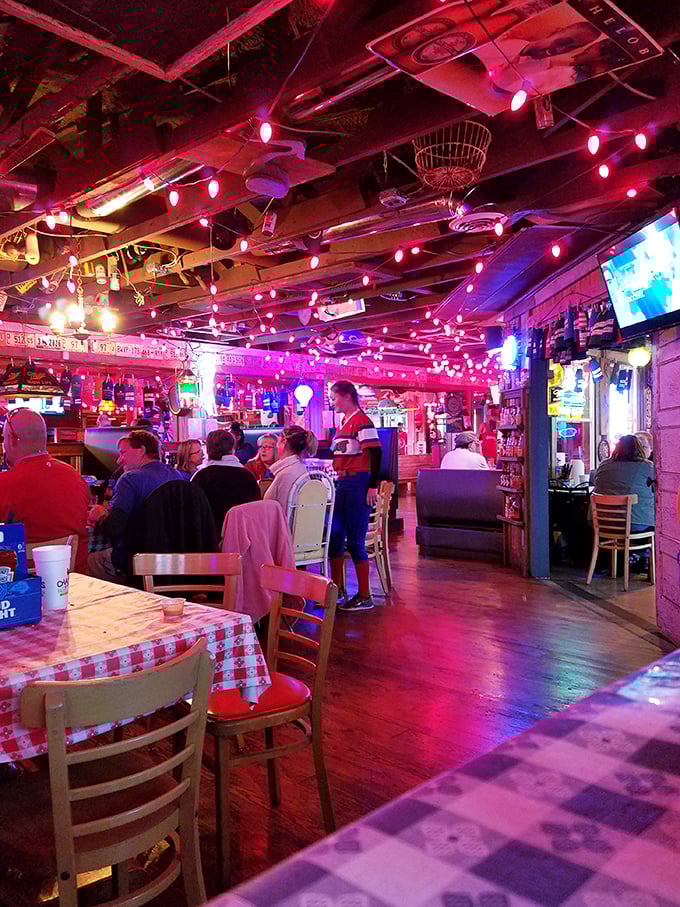 Where strangers become friends over shared love of fried chicken. The pink glow makes everyone look like they're having the time of their lives. 