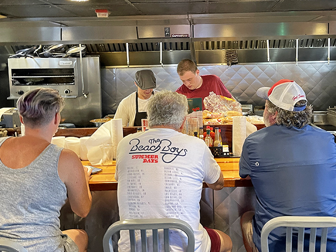 The counter seating at Big Sam's offers dinner and a show—watching skilled hands transform simple ingredients into coastal magic is better than anything on Netflix.