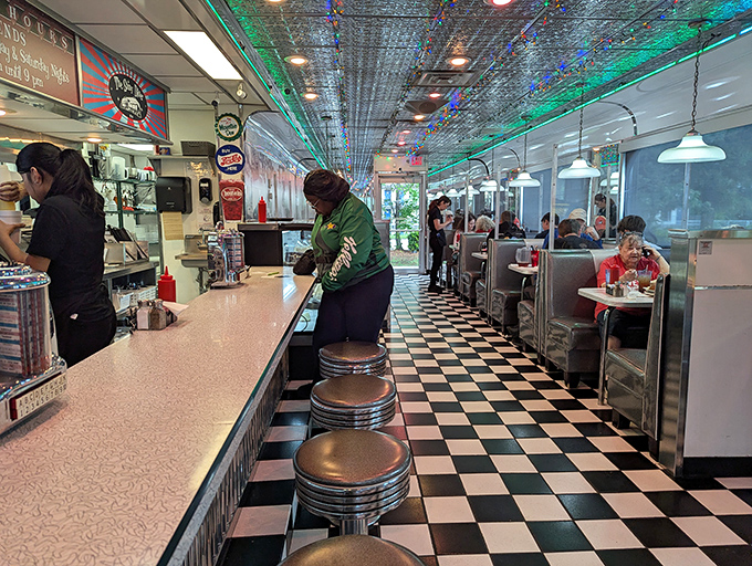 The counter is where the magic happens—where solo diners find community and the rhythm of short-order cooking becomes a delicious symphony.