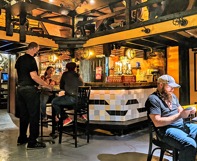 The bar scene at Bube's—where strangers become friends and friends become regulars over pints of history-infused brews.