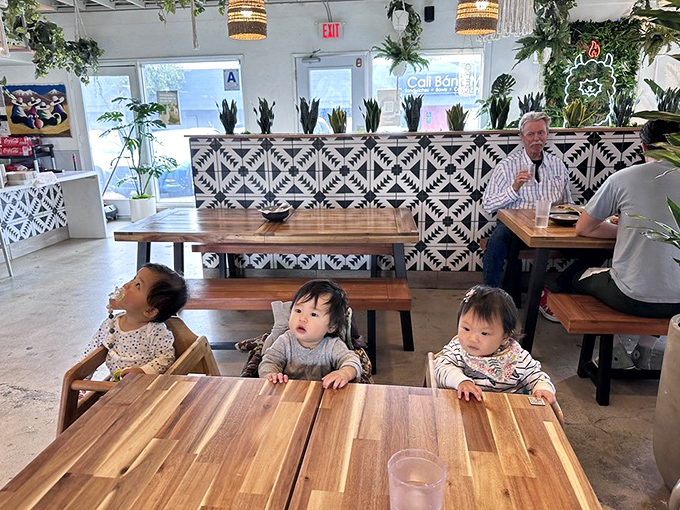 Family-friendly without sacrificing style—wooden tables built for sharing plates and creating memories. Those high chairs have witnessed countless first bites.