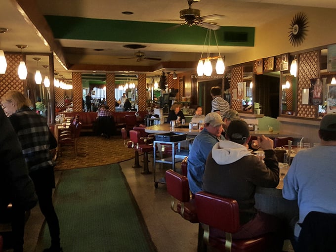 Where memories are made between bites—three generations sharing breakfast while debating whether pancakes or waffles reign supreme in the breakfast hierarchy.