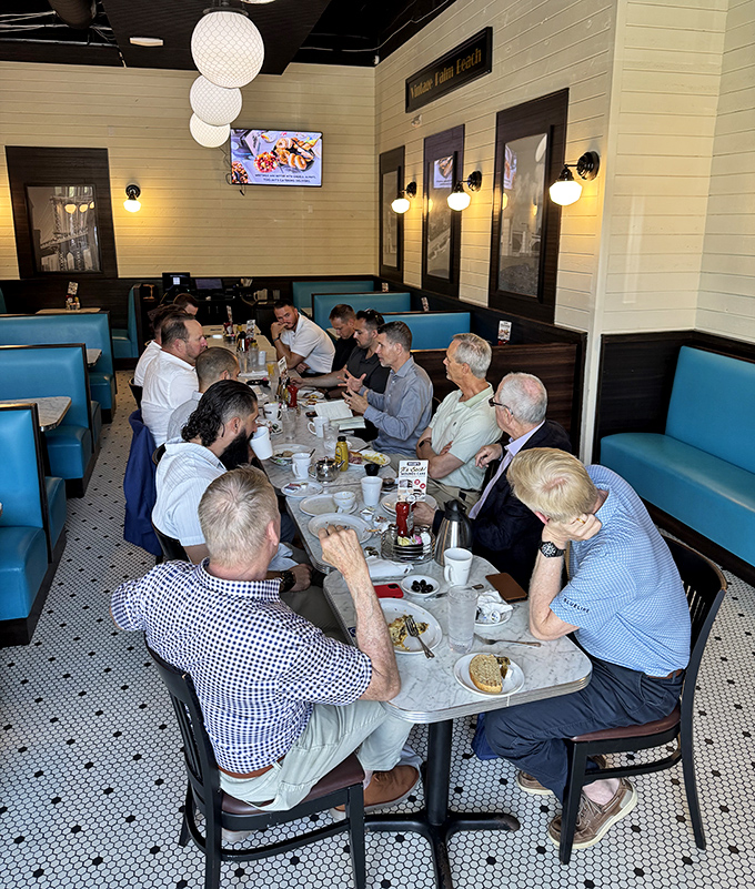 A gathering around TooJay's tables isn't just a meal—it's a summit of sandwich enthusiasts plotting their next move in the game of delicious decisions.