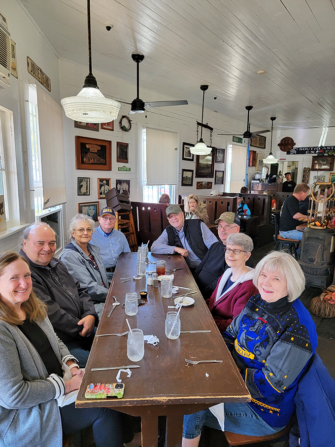 The communal table isn't just furniture—it's where strangers become friends over sweet tea and shared stories. Southern dining at its most authentic.