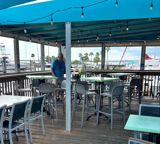 Covered outdoor seating with marina views—where the "I'll just have one drink" promise goes to die a happy death.