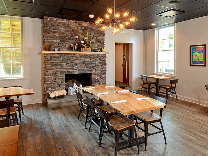 A stone fireplace anchors the dining room, creating the perfect backdrop for the serious business of BBQ appreciation – like Thanksgiving at your coolest relative's house.