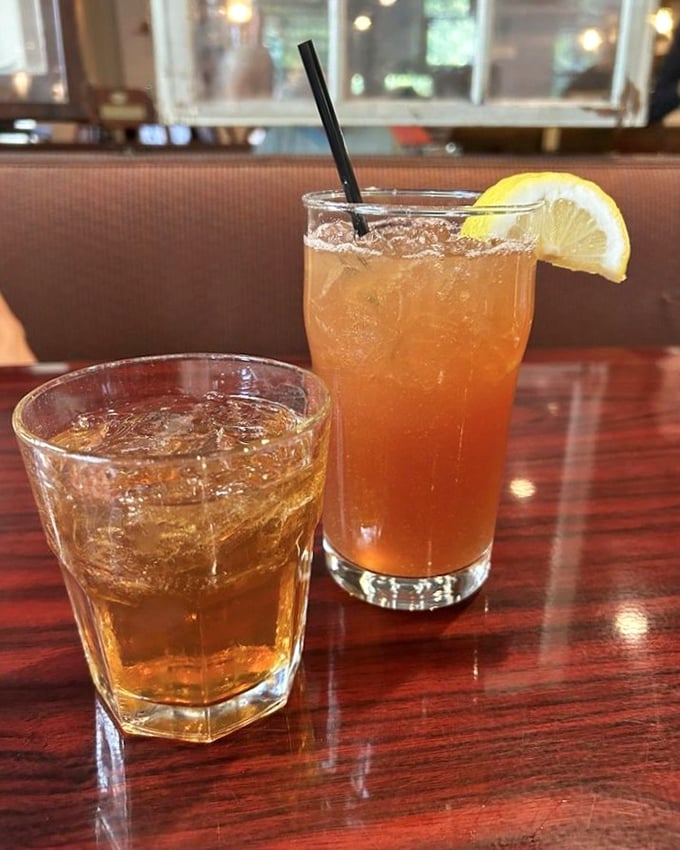 Cocktail hour at Kelly's means handcrafted libations that complement the menu perfectly. That amber glow isn't just from the drinks—it's anticipation.