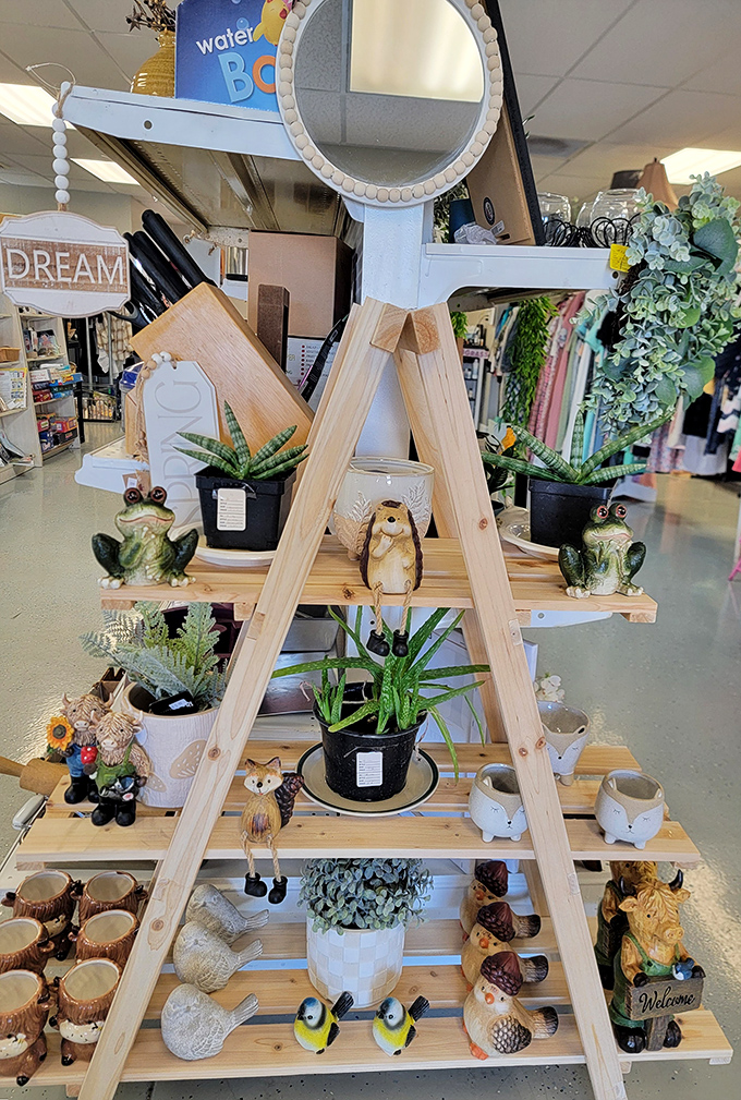 This wooden A-frame display showcases whimsical garden creatures just waiting to bring character to someone's patio or windowsill.