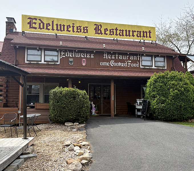 "Home Cooked Food" isn't just a promise on the sign—it's the restaurant's entire philosophy, wrapped in wood siding and topped with a distinctive yellow banner.