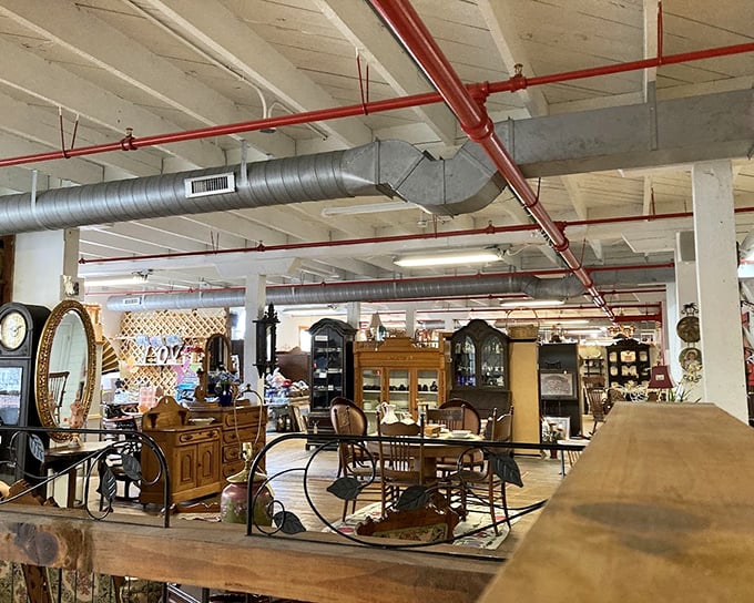 Industrial chic meets timeless elegance in this furniture display where each piece carries the patina of lives well-lived.