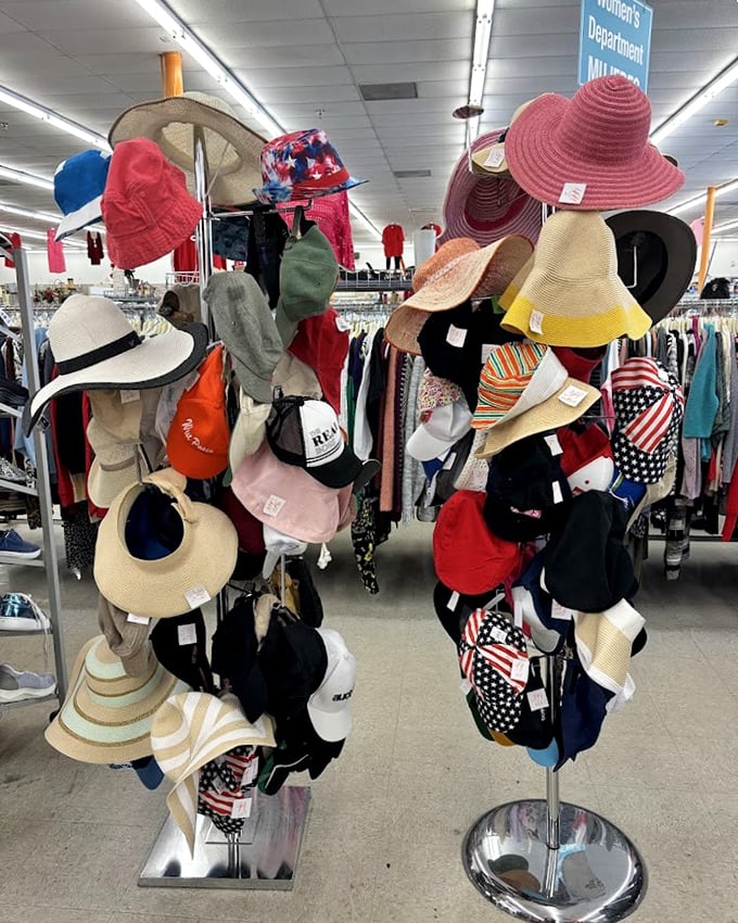 The hat section—where wide-brimmed sun protection meets patriotic baseball caps in a glorious display of headwear democracy.