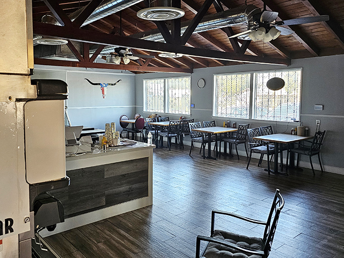 Where Texas meets California under exposed wooden beams. Simple tables waiting for the main event—a parade of smoky delights.