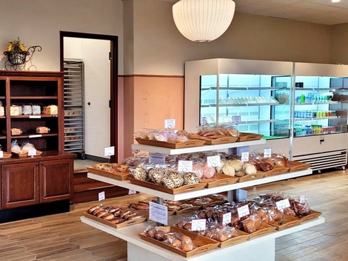 Shelves stocked with Japanese baking brilliance. Each wooden display is a stage where bread and pastry perform their delicious symphony.