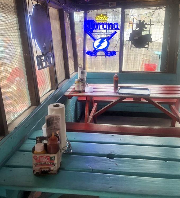 Neon beer signs, wooden paneling, and that unmistakable Florida blue—this isn't interior design, it's a time machine to simpler days.