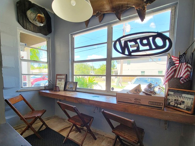 Counter seating with a view of the action—the best seats in the house. Where fishing tales and culinary magic converge under vintage ceiling fans.