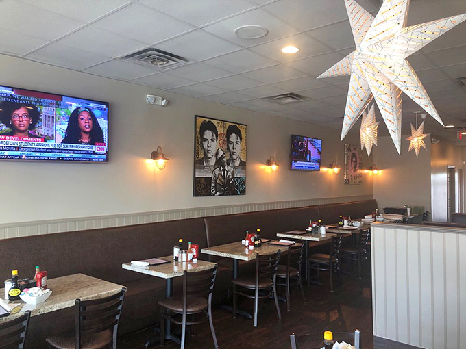 The dining room balances casual comfort with just enough style to make you forget you're in a strip mall. Those star lights aren't just decor—they're foreshadowing the star-worthy breakfast.