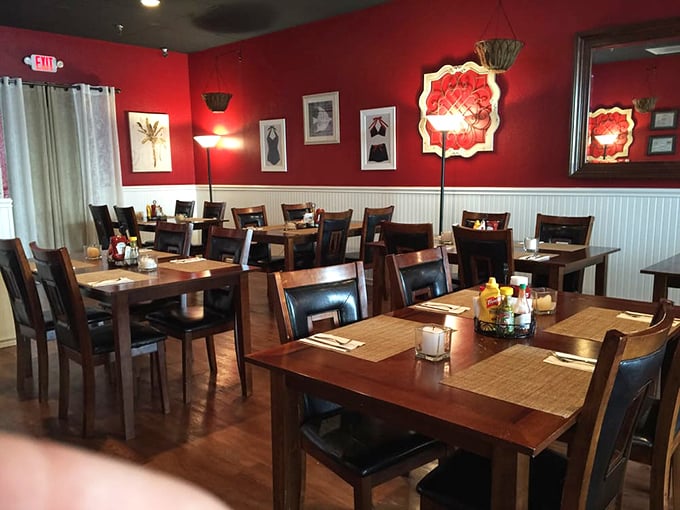 The crimson walls and warm wood tones create that perfect "neighborhood favorite" ambiance – elegant enough for special occasions, comfortable enough for Tuesday night dinner.