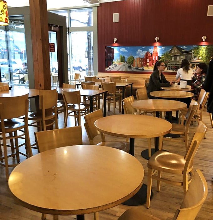 Round tables invite lingering conversations and spontaneous friendships. The mural of Little Italy on the wall reminds you exactly where carb paradise is located.