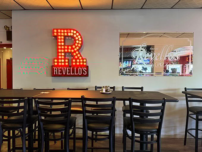 The illuminated "R" isn't just a letter—it's a landmark that's guided hungry travelers to pizza paradise for decades.