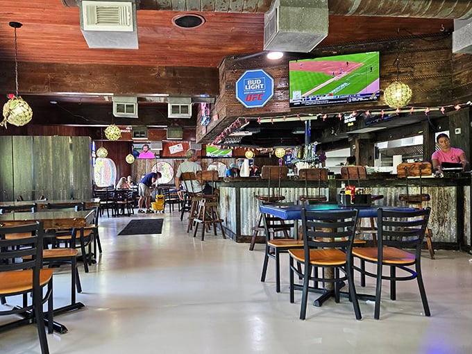 No designer needed here—just decades of authentic coastal charm. The wooden beams, hanging lights, and comfortable seating create the perfect backdrop for seafood feasting.