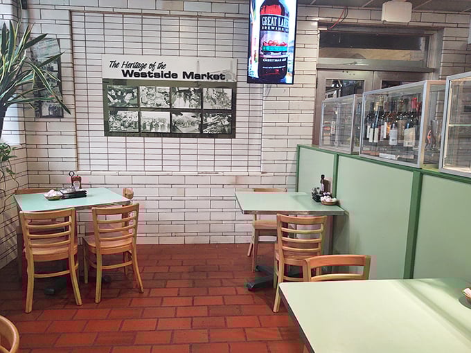 Historic photos watch over mint-green tables, preserving West Side Market memories while new ones are being made over breakfast.